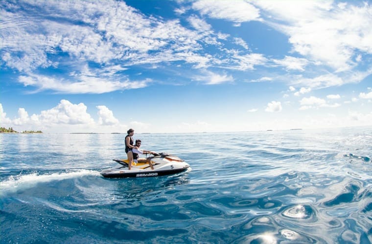 Two People Riding On Jet Ski