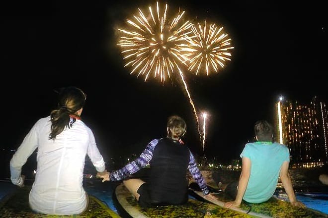 Nighttime Paddleboard under Fireworks &mdash; Honolulu