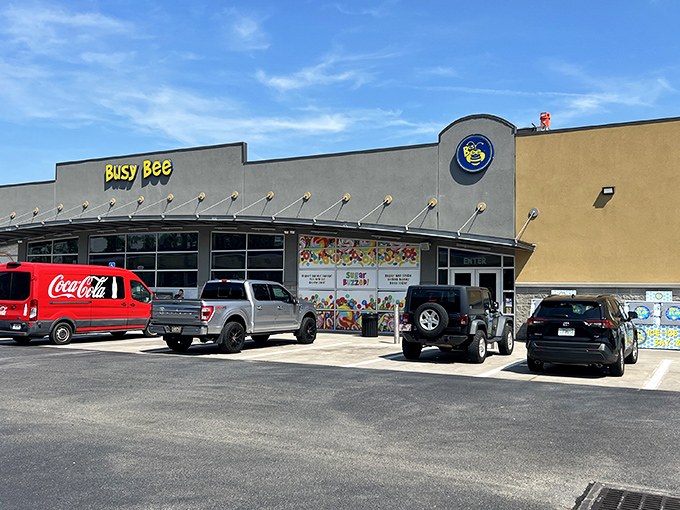 The welcoming facade of Busy Bee stands out like a roadside oasis, promising weary travelers much more than just fuel and a bathroom break.
