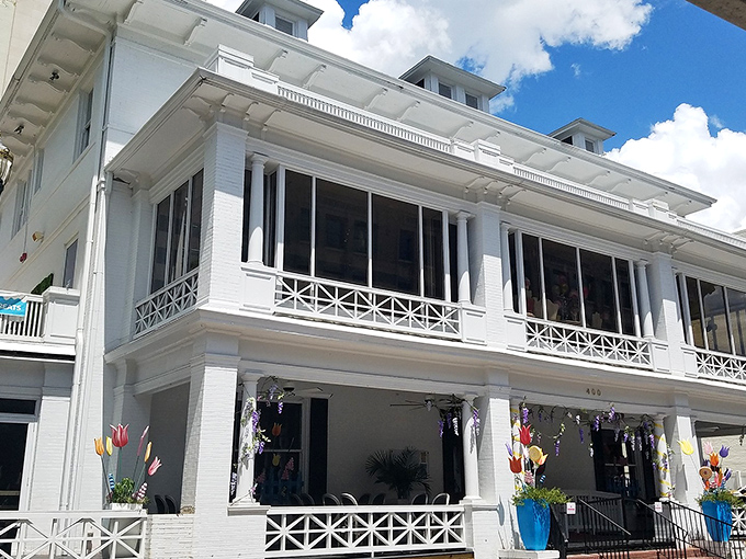 A grand Victorian mansion transformed into a candy kingdom &ndash; Sweet Pete's exterior promises whimsical delights within its pristine white walls.