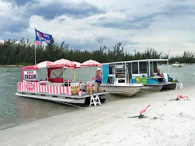 The pink-striped ice cream boat looks like a carnival decided to go nautical, and honestly, that's exactly the energy Keewaydin Island brings to the table.