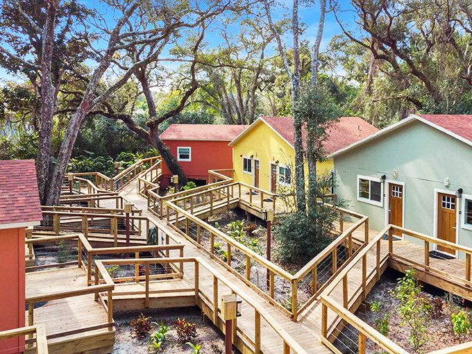 Welcome to Sea Cottages of Amelia, where childhood treehouse dreams meet grown-up comfort in a vibrant village connected by wooden boardwalks.