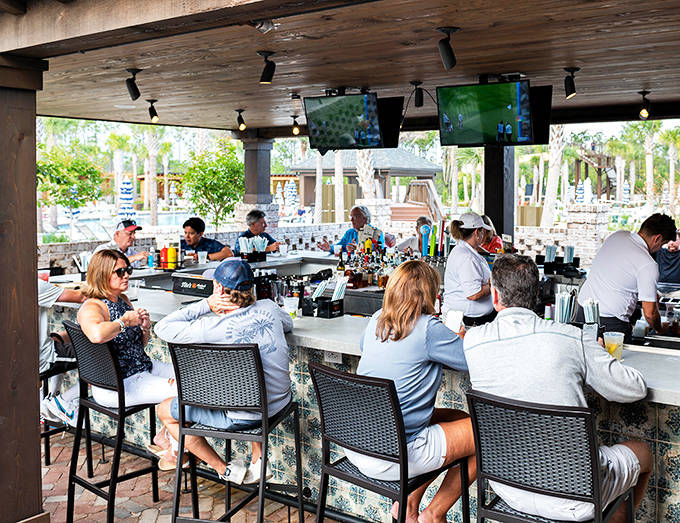 Cheers to vacation life at our lively outdoor bar, the perfect spot to cool off with refreshing drinks and friends.