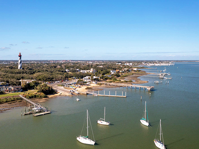 Sailboats dance beneath A1A's graceful span, where coastal living meets maritime adventure in perfect harmony.