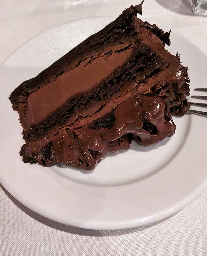 Layers of chocolate cake stacked impossibly high create a dessert that makes loosening your belt completely worthwhile.