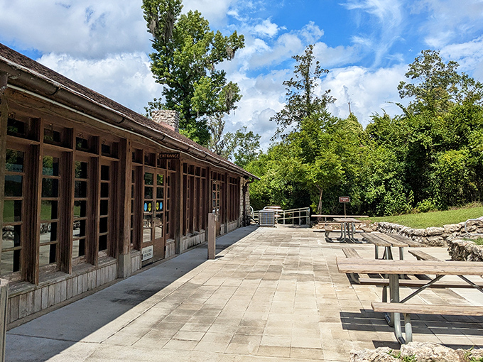 The visitor center's rustic architecture blends seamlessly with its natural surroundings, like a stone cottage from a woodland fairy tale.