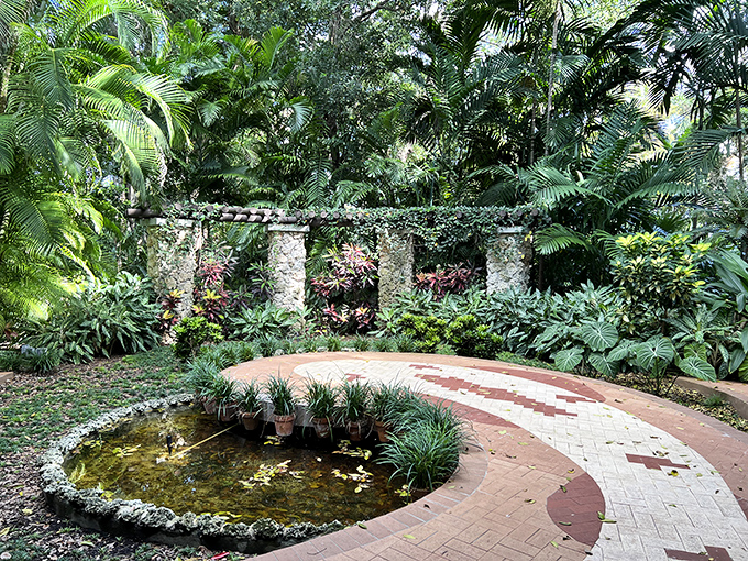 A natural archway of mangrove roots frames the entrance to Oleta's hidden water trails, where time slows to the rhythm of paddle strokes.