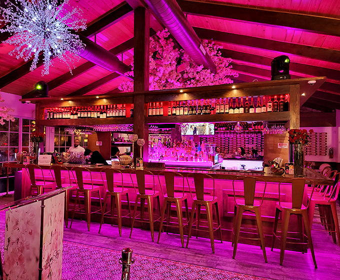 Pink lighting transforms this bar into the set of a sophisticated music video – just add friends and your favorite wine.