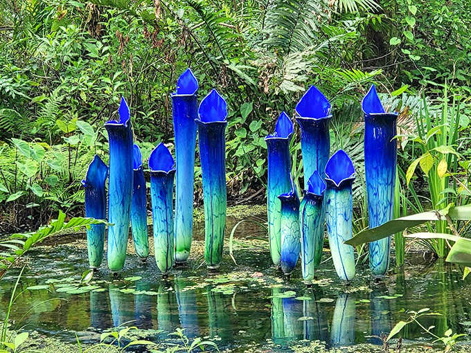 Blue glass spires rise from still waters like frozen fountains, catching sunlight and turning science into magic.