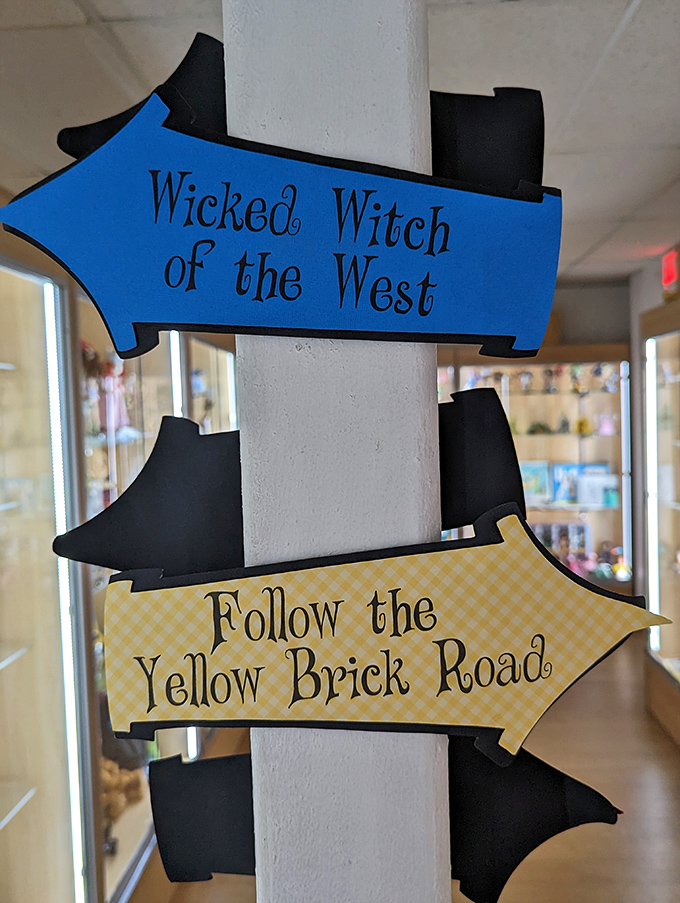 Directional signs point toward the Wicked Witch or the Yellow Brick Road, because even in a museum, it helps to know which way you're headed.