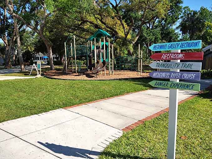 Playground: Colorful directional signs point the way to various attractions, promising adventures from mermaid shows to wilderness trails all within walking distance.