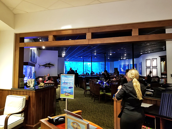 A glimpse into the restaurant's elegant interior design &ndash; notice how the lighting creates an underwater ambiance without sacrificing visibility.