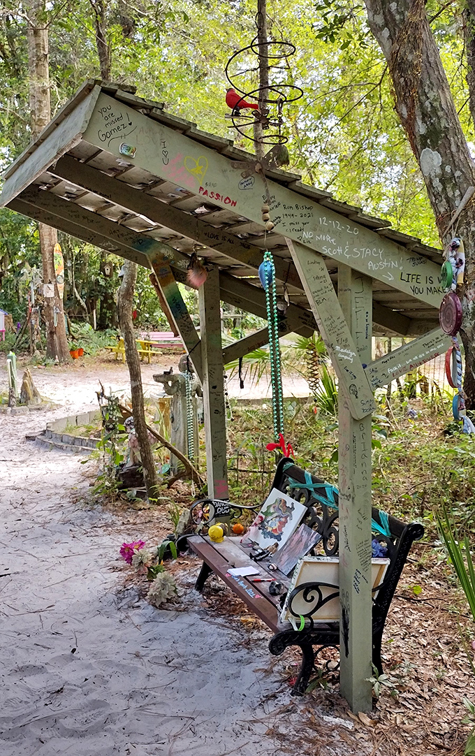 The visitor-created bench area serves as both art installation and resting spot, covered in messages from those touched by the trail's magic.