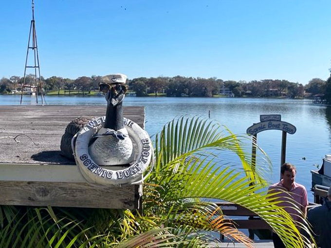 Even the statues enjoy the view! This whimsical dock guardian keeps watch over Lake Osceola with a life preserver at the ready.