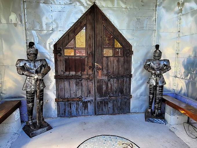 Knight sentinels flank the wooden entrance, standing eternal watch over a doorway that promises wonders beyond your wildest imagination.