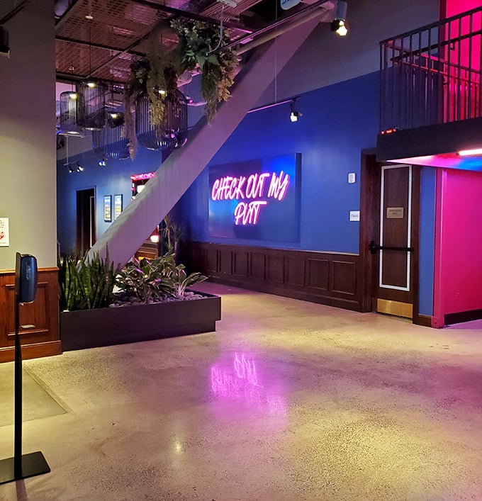 The "Check Out My Putt" neon sign perfectly captures the venue's playful vibe. Instagram opportunities lurk around every colorful corner.