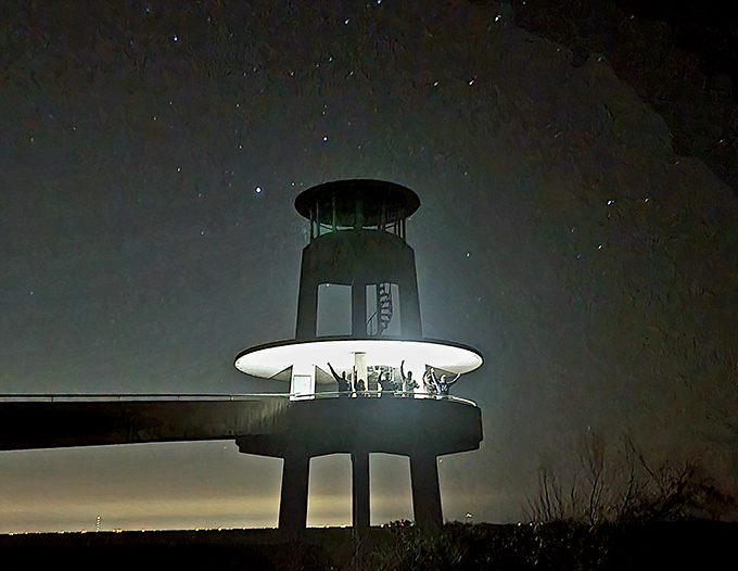 Under starry skies, the illuminated tower transforms into a lighthouse for the river of grass, guiding nocturnal creatures and night photographers alike.