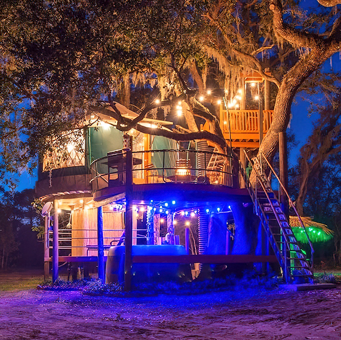 Nighttime transforms the treehouse into a magical lantern glowing among the branches &ndash; proof that fairy tales don't end when you grow up.