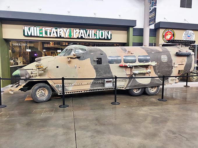 This military transport vehicle looks like it rolled straight off a desert battlefield &ndash; its rugged construction and camouflage paint tell stories of service.