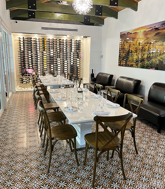 Wine walls and wooden beams frame this intimate space where important decisions are made – like which bottle to open next.