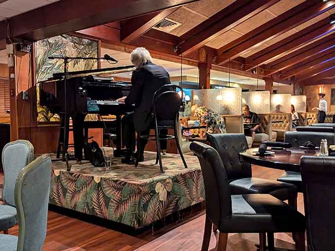 Live piano music fills the dining room, adding elegant entertainment to an already sophisticated evening of fine dining.