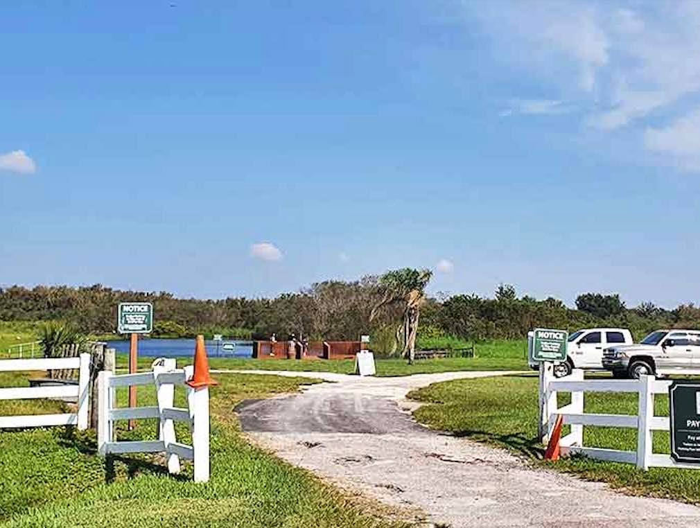 The entrance to adventure looks deceptively simple, just a gate and a promise of experiences you definitely won't find at your average Florida resort.