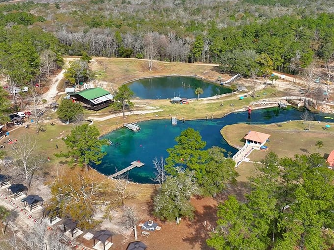 Aerial view: From above, the spring's true magnificence reveals itself&mdash;a perfect blue jewel set in a verdant forest crown.