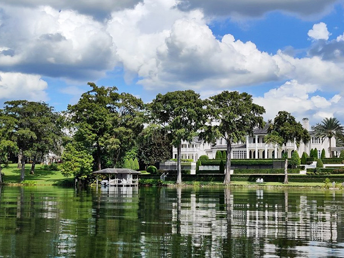 "And on your right..." Jaws drop as the tour passes one of Winter Park's most impressive lakefront estates, where luxury meets landscape.