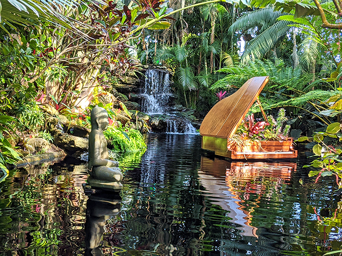 A serene waterfall creates nature's soundtrack while a Buddha statue reminds visitors to find their inner zen&mdash;or at least pretend to.