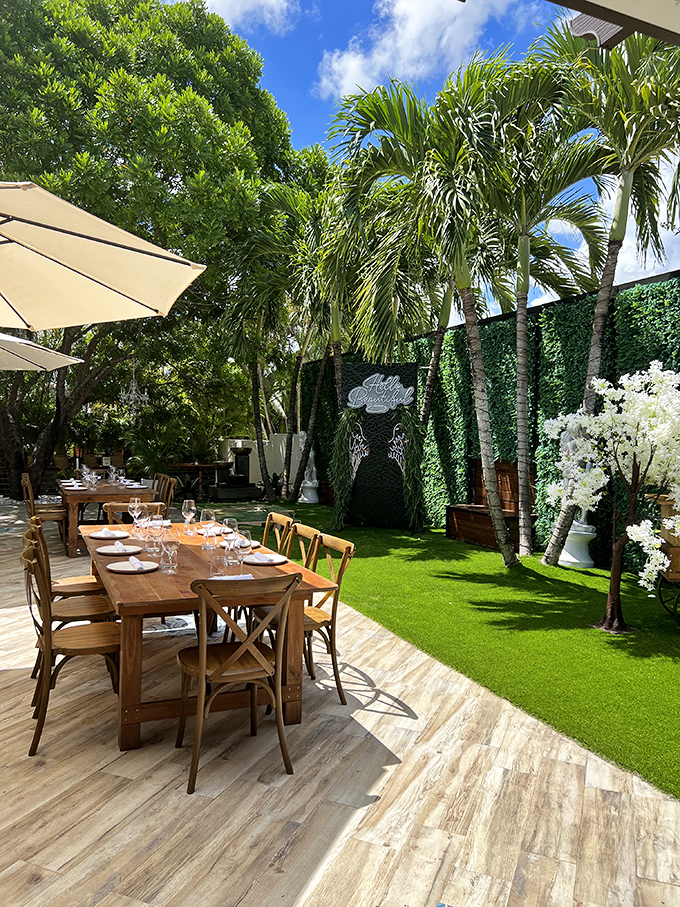 Al fresco perfection! Palm trees, wooden tables, and Florida sunshine combine to create the ideal setting for lingering over "just one more glass."