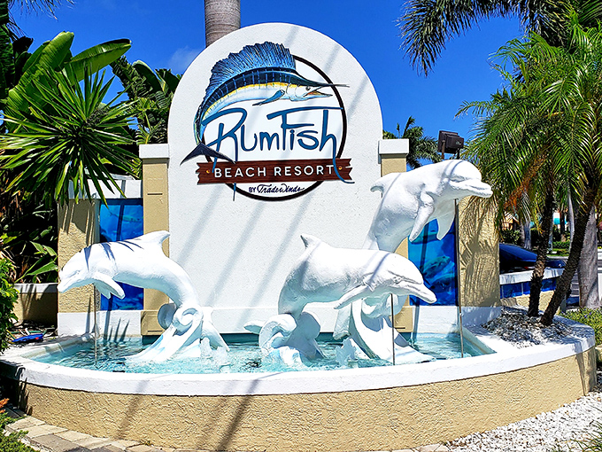 RumFish's iconic dolphin fountain welcomes guests with a playful splash &ndash; a perfect photo opportunity before your underwater dining adventure.