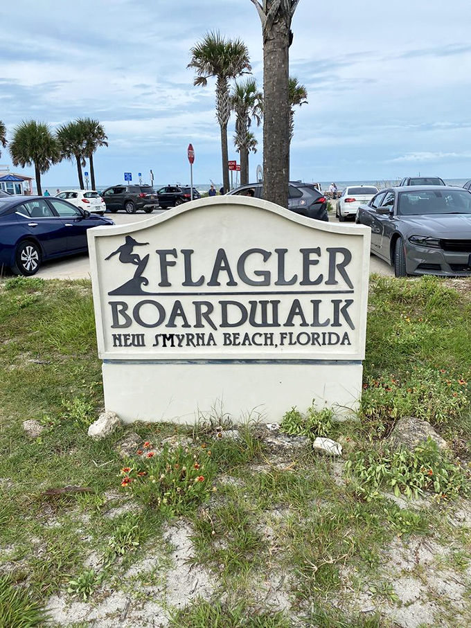 A simple sign marks the entrance to adventure, where the Flagler Boardwalk begins its journey toward sun, sand, and unforgettable memories.