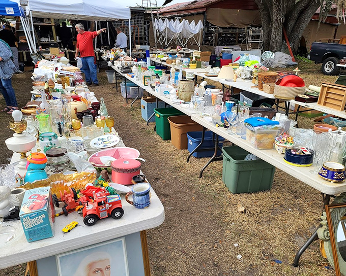 Everyday items become potential treasures on these outdoor display tables, where household goods and vintage toys await eagle-eyed collectors.