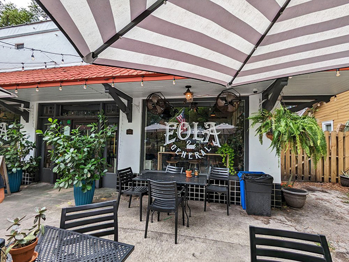 Dappled sunlight filters through leafy branches onto this urban retreat, where conversations flow as freely as the coffee and wine.