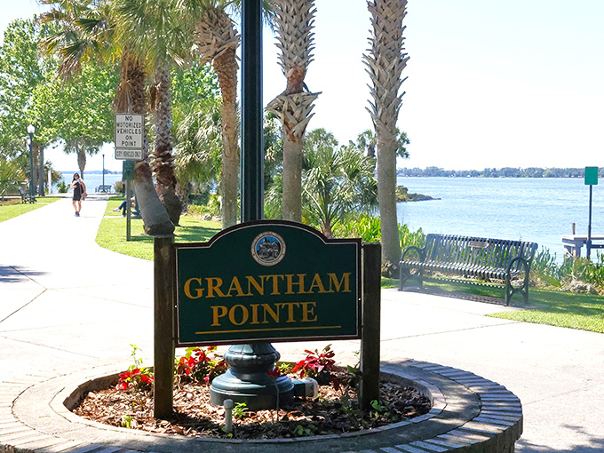Grantham Pointe's welcoming sign stands sentinel, inviting wanderers to discover this peaceful lakeside retreat in the heart of Florida.