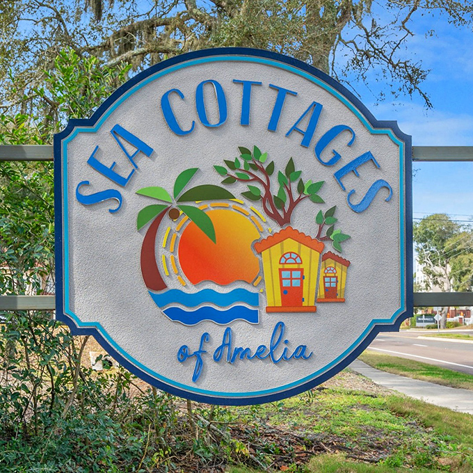 The distinctive Sea Cottages of Amelia sign welcomes travelers to a vacation experience that's both grounded in nature and elevated in comfort.