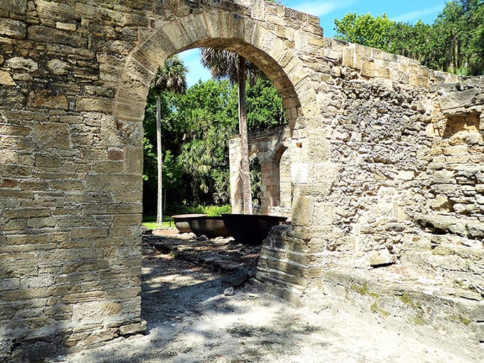 Ancient coquina ruins stand as silent sentinels to Florida's rich past, their weathered arches framing glimpses of a bygone era.