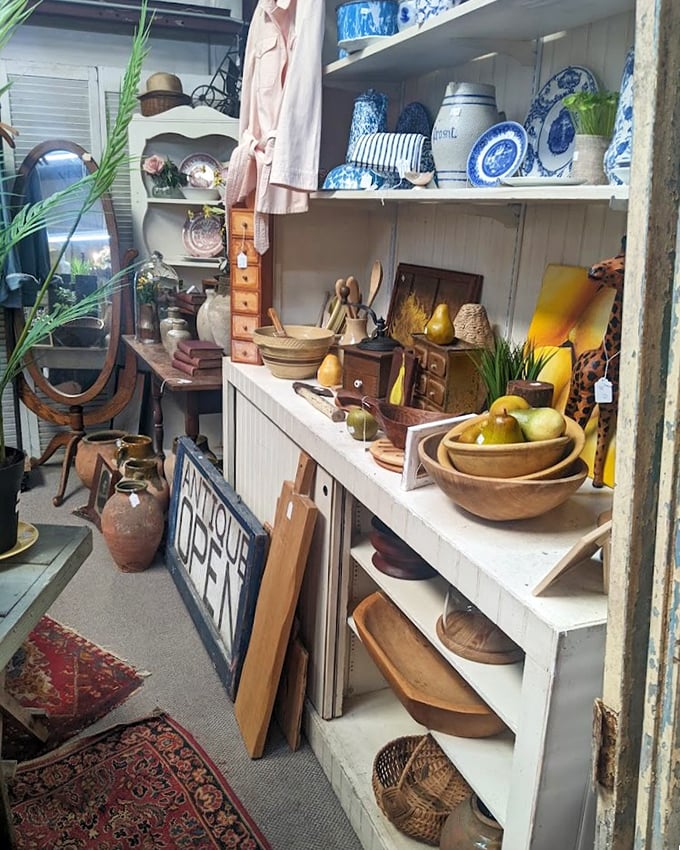 A collector's dream corner where blue and white porcelain mingles with wooden treasures &ndash; each shelf telling stories of homes from bygone eras.