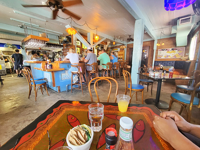 Pull up a chair at the bar where island stories flow as freely as the mojitos.