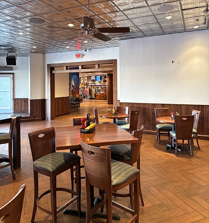 Warm wood tones and comfortable seating create an inviting atmosphere where conversations flow as easily as the cocktails.