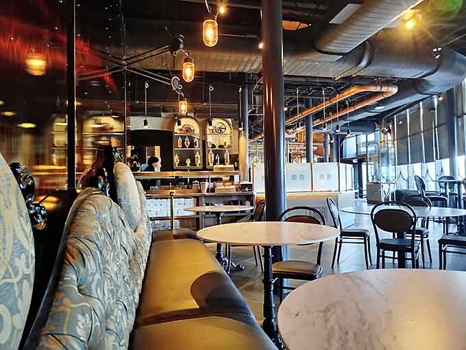 Inside looks like Jules Verne designed a chocolate shop after binge-watching every Victorian-era movie ever made.