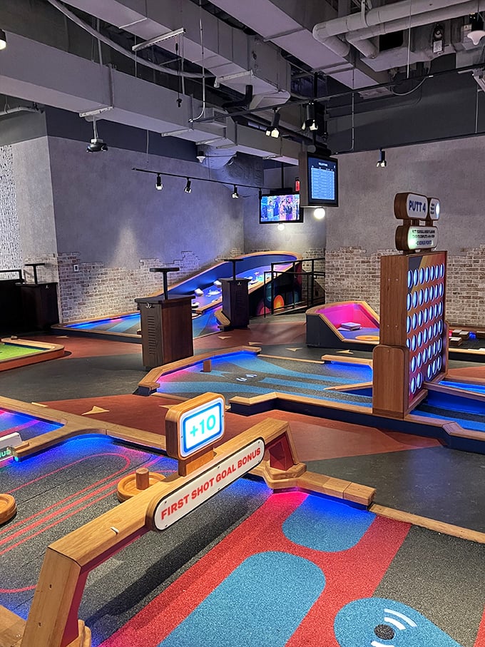 Step inside and witness mini-golf's evolution – glowing courses surrounded by vibrant light tubes create an atmosphere that's part nightclub, part sports arena.