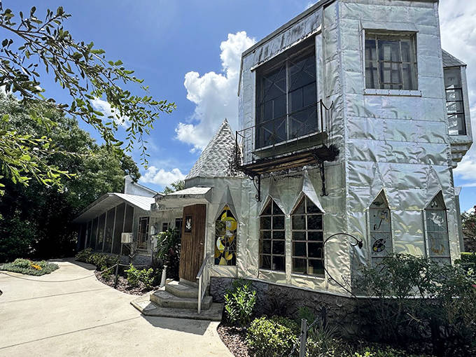 The side view reveals intricate details of this recycled masterpiece, where discarded printing plates transform into royal architecture with a distinctly Florida twist.