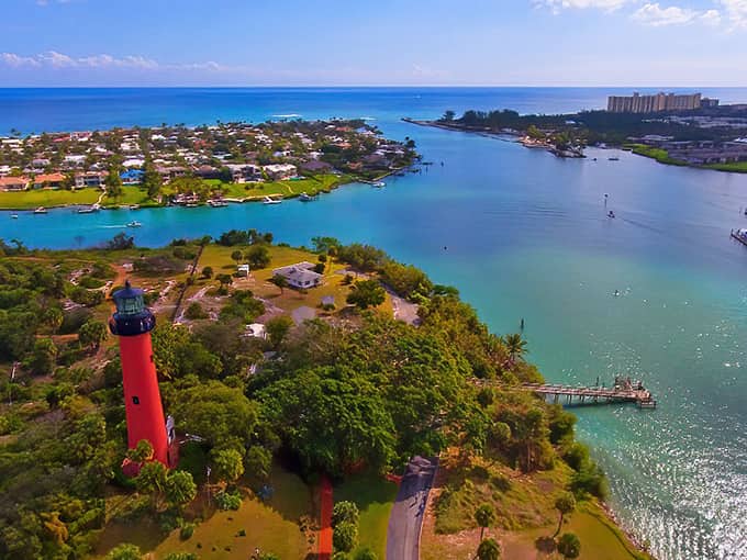 Jupiter Inlet Lighthouse rises like a red beacon of adventure, promising views that'll make your heart soar.