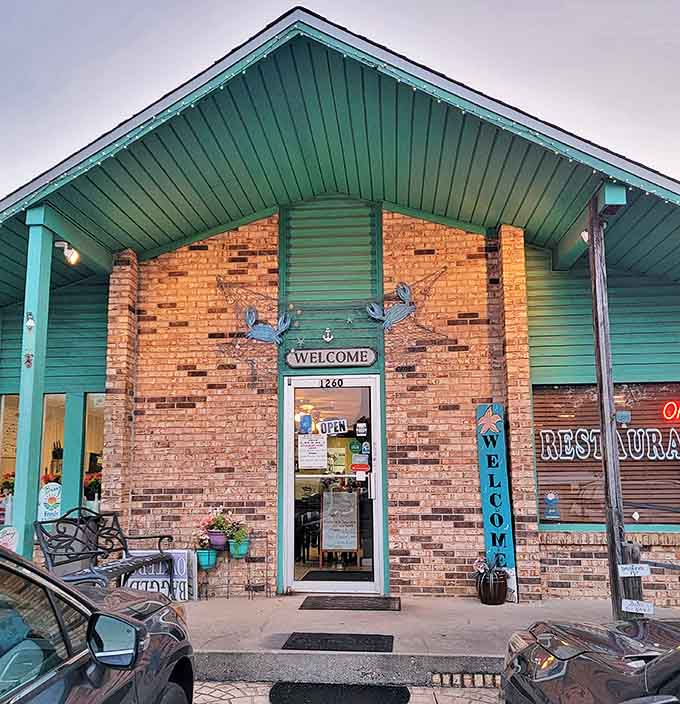 Blue crab decorations adorn the entrance to Emerald Isle, where the "WELCOME" sign promises hospitality as fresh as their seafood.