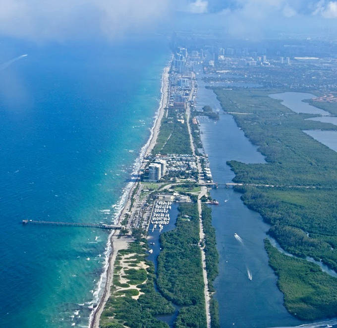 From above, the narrow strip of paradise reveals its true character – a perfect balance of Atlantic blue on one side, Intracoastal calm on the other.