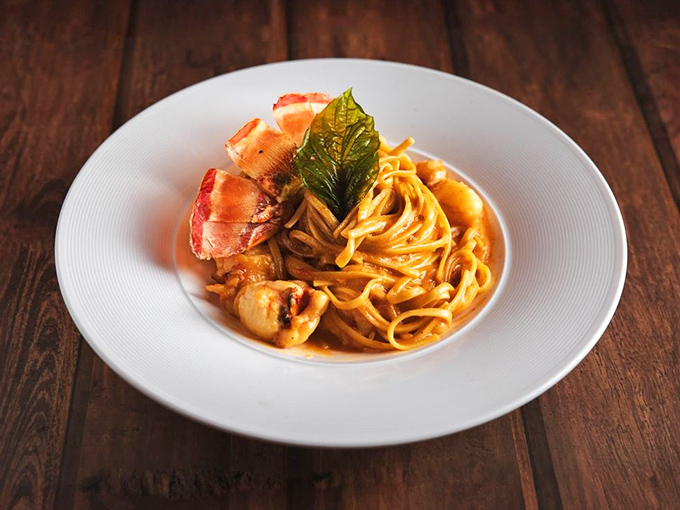 Pasta perfection! Generous chunks of lobster swim in a creamy sauce that'll have you contemplating licking the plate when no one's looking.