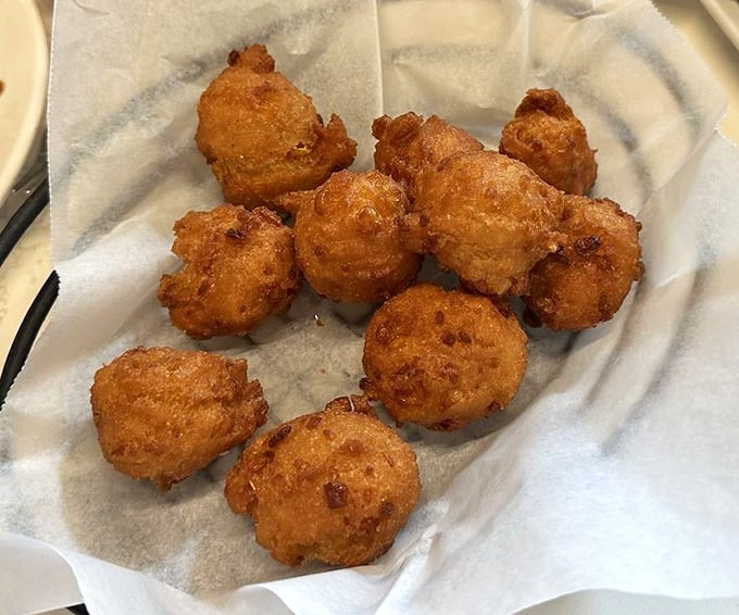 Golden-fried hush puppies arrive piping hot, their crispy exteriors giving way to tender, steamy centers &ndash; the perfect start to any Norwood's meal.