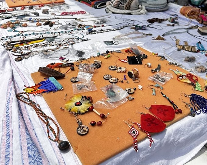 Handcrafted jewelry spreads across makeshift displays, each piece whispering secrets of fashion trends and personal stories from decades past.