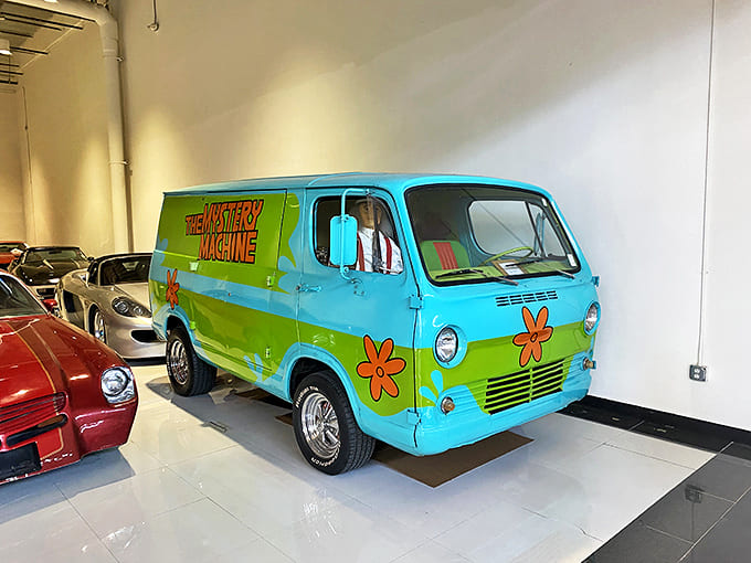 Zoinks! The Mystery Machine looks like it just rolled off the Scooby-Doo set, complete with psychedelic paint job and flower power vibes.